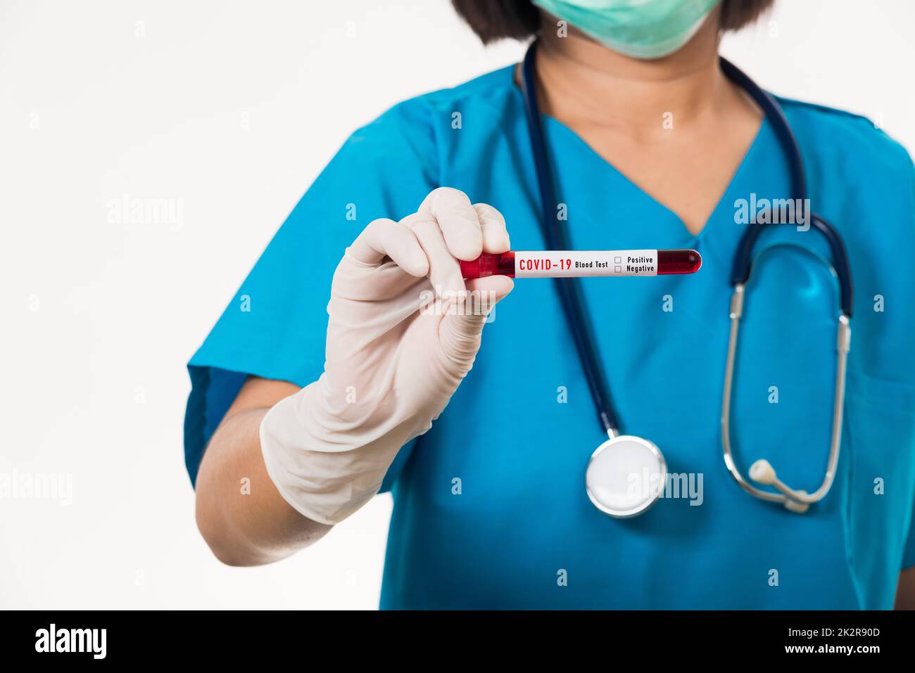 Nurse in blue uniform wear a mask holding test tube sample Coronavirus ...