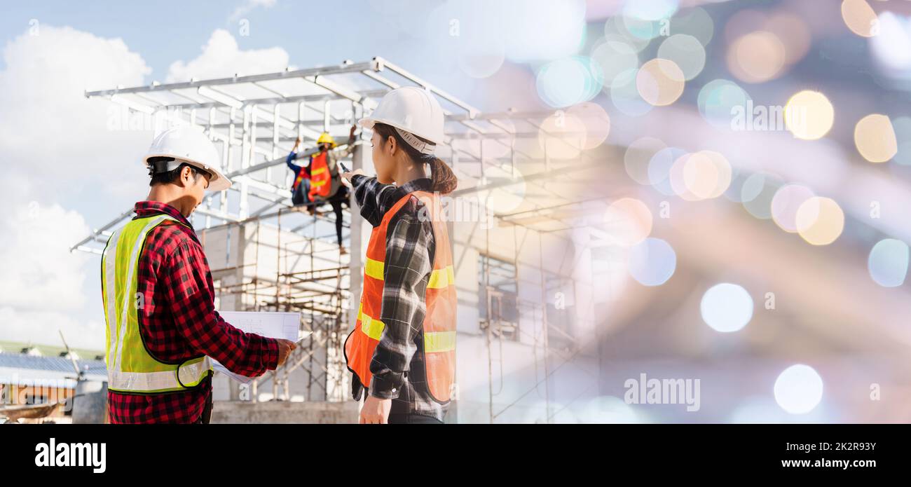 Back two architect and client discussing help create plan with ...