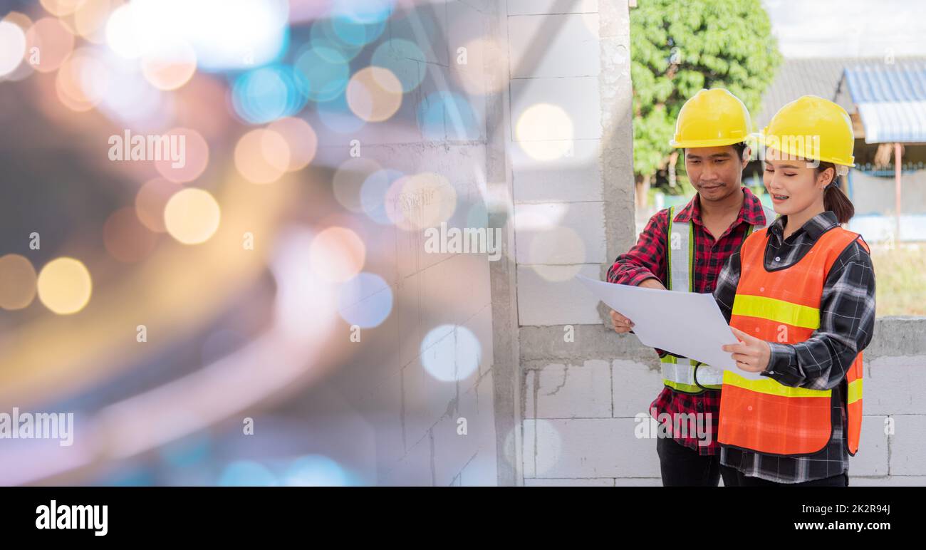 Architect and client discussing the plan with blueprint of the building ...