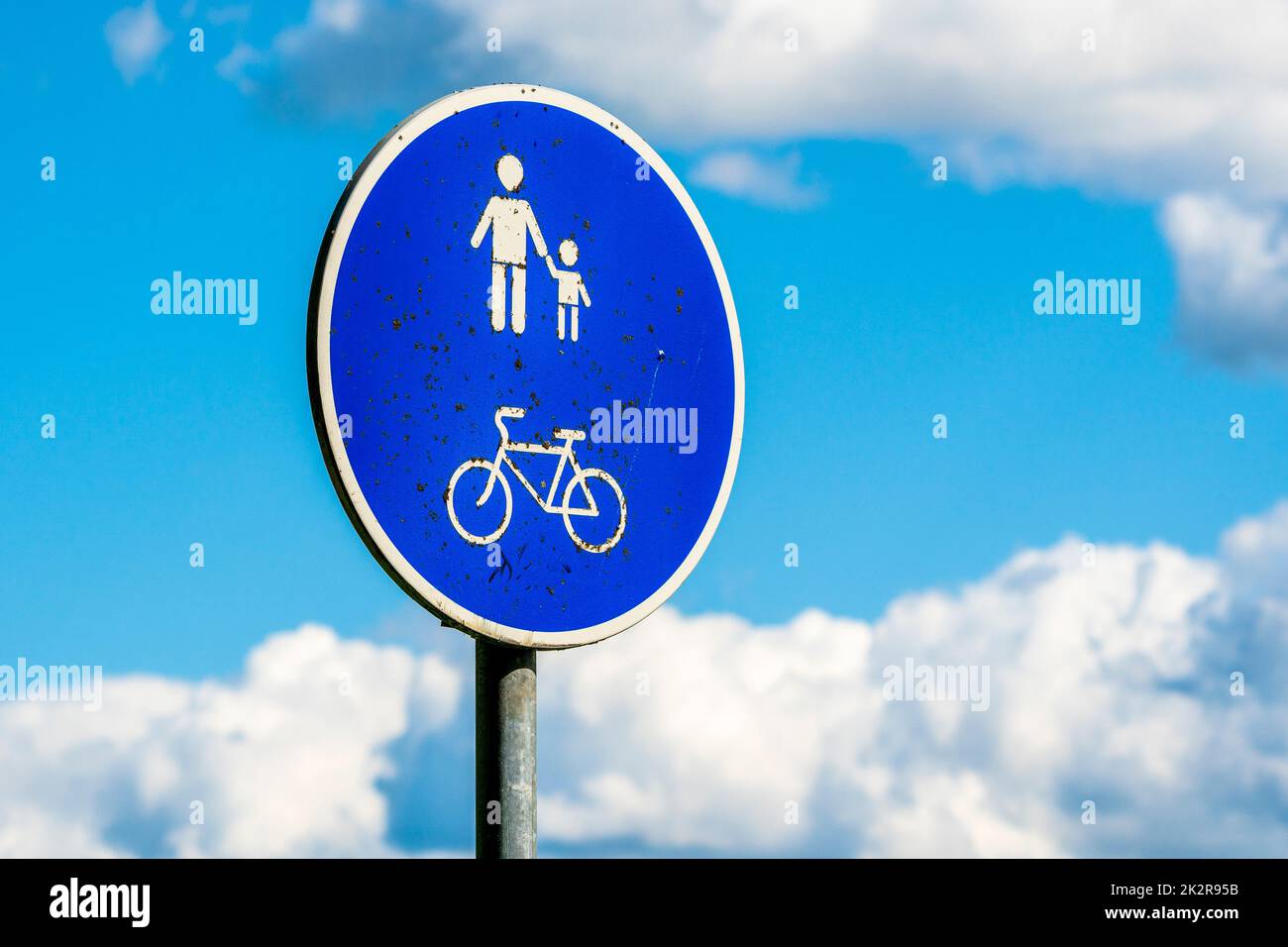 Cyclist & pedestrian road sign on the sky background Stock Photo - Alamy