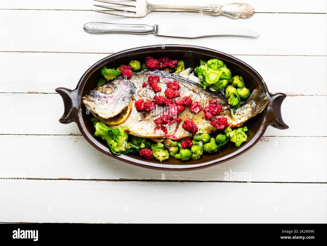 Tasty gilthead fish in berry sauce Stock Photo - Alamy