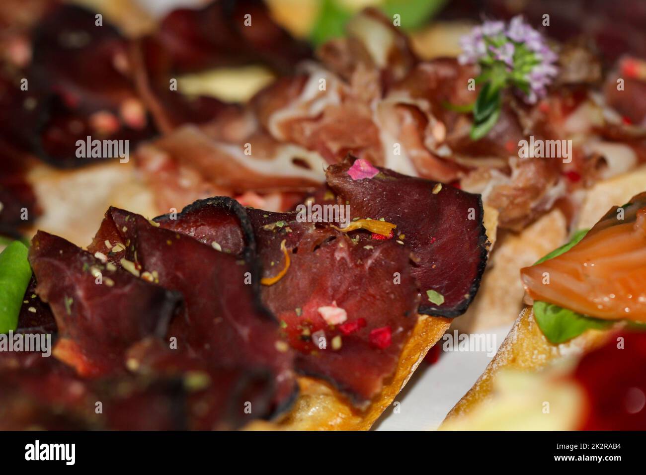 Sliced smoked wine red ham arranged on a platter Stock Photo - Alamy