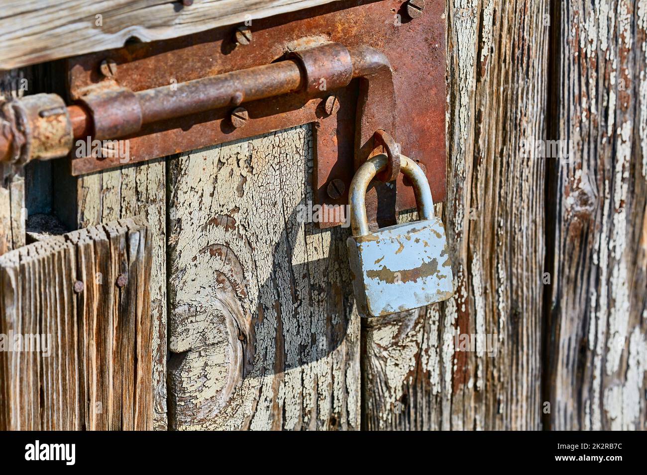 Locked gate for a wooden shed Stock Photo - Alamy
