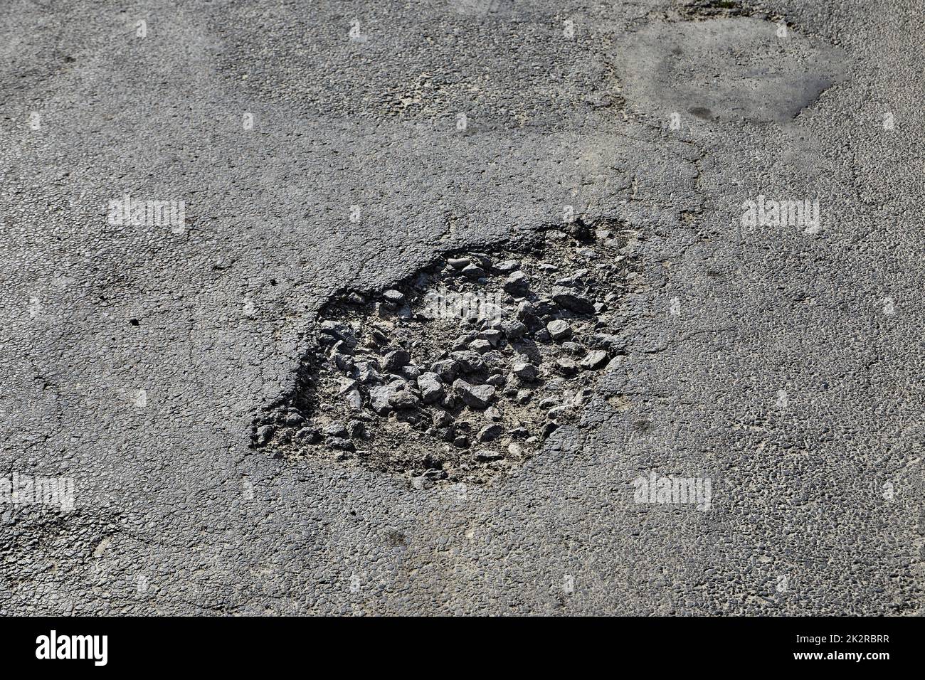 Potholes on asphalt road hi-res stock photography and images - Alamy
