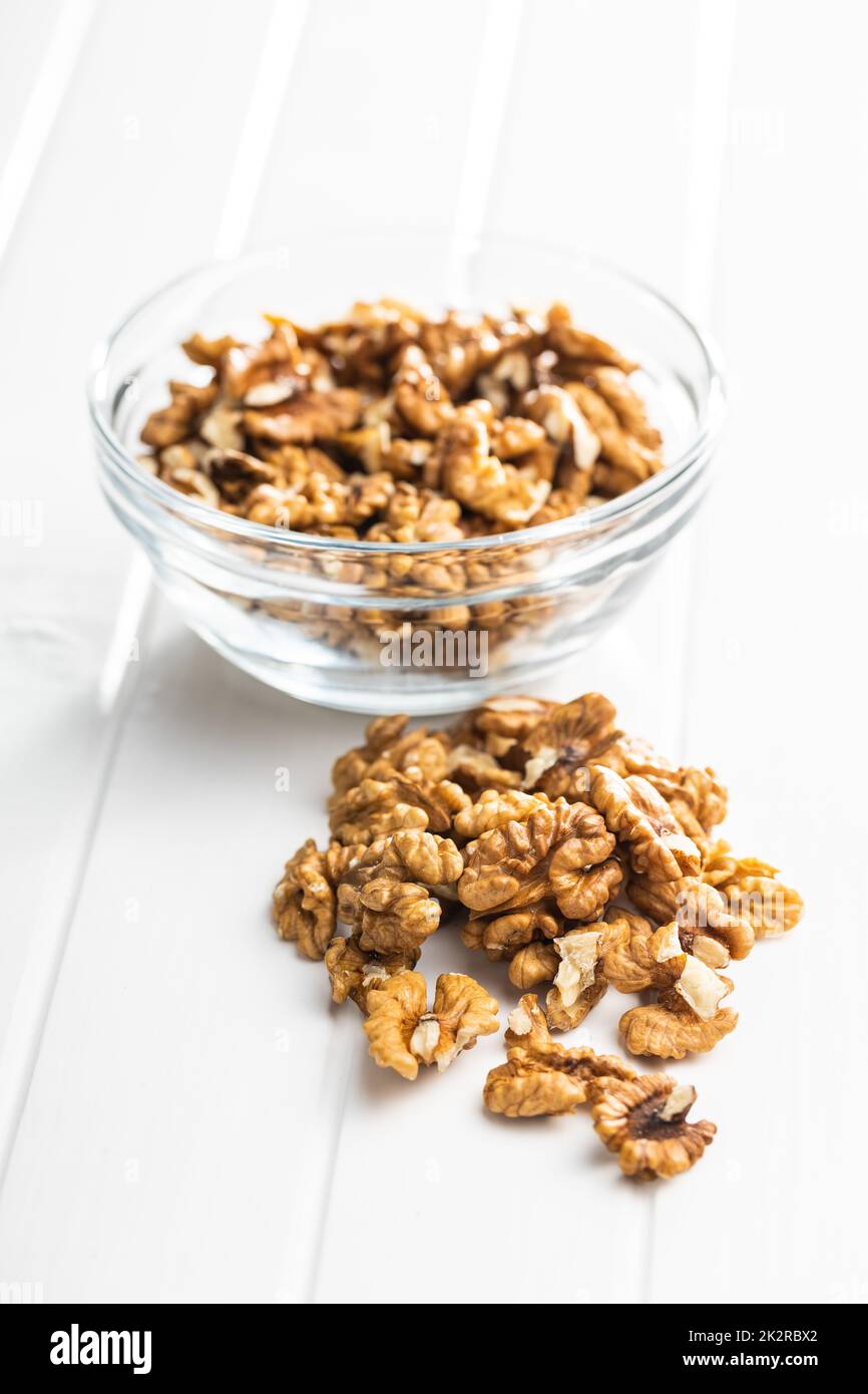 Peeled walnut kernels on white table Stock Photo - Alamy