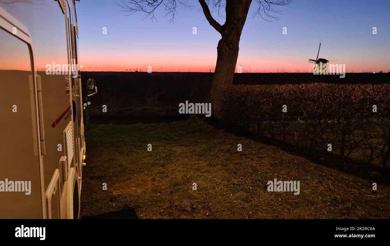 Camper van in the sunset Stock Photo - Alamy