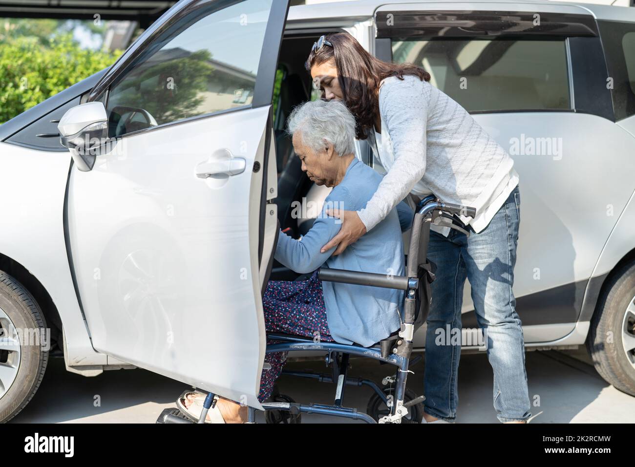 Asian senior or elderly old lady woman patient sitting on wheelchair ...