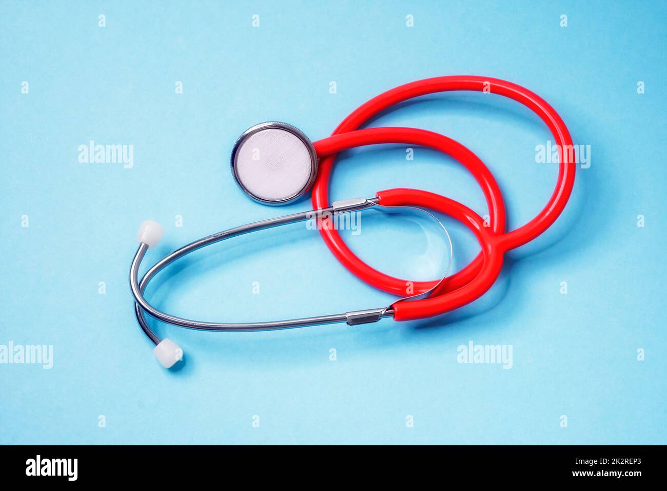Red stethoscope, close up and still life of a modern stethoscope for ...
