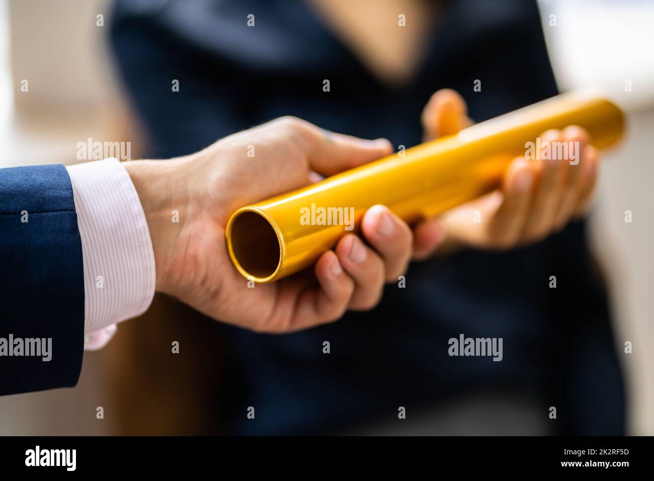 Business Man And Woman Relay Baton Handover Stock Photo - Alamy