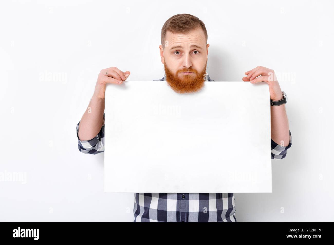man with beard holding big white card Stock Photo - Alamy