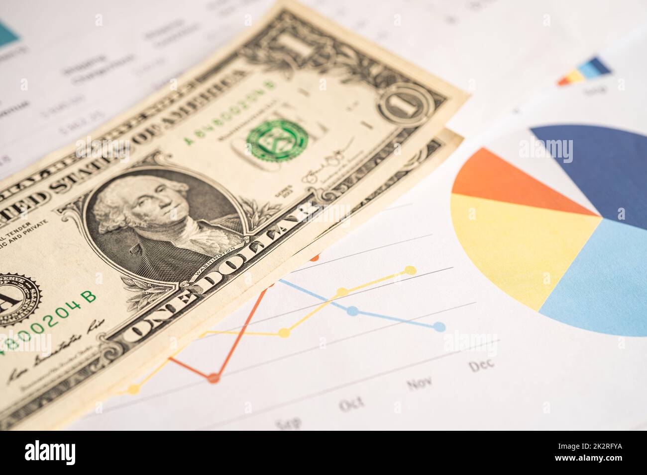 US dollar banknotes on chart and graph paper, Finance, Account ...