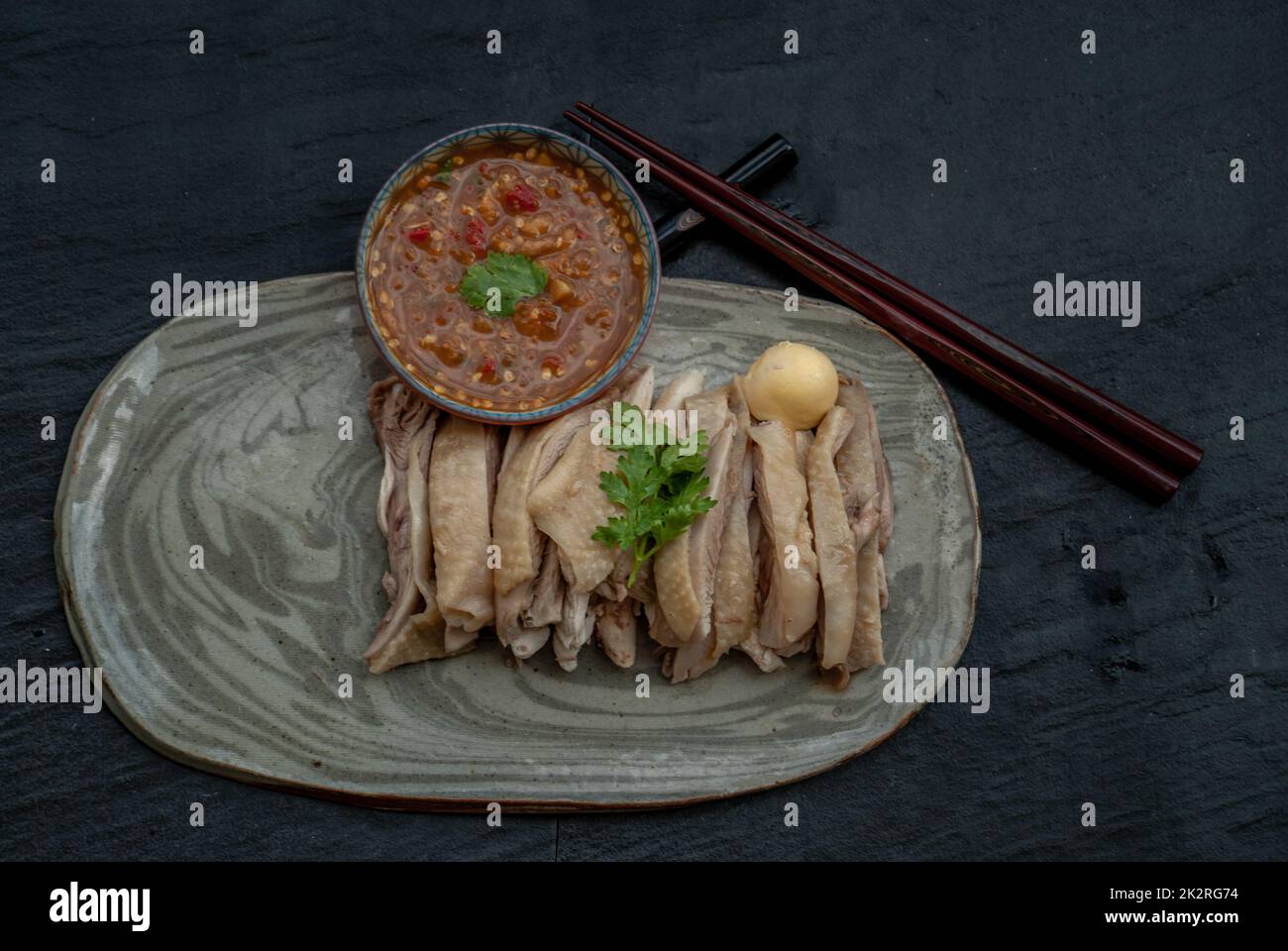 Asian food style marinated steamed chicken (Betong Chickken) and sauce ...