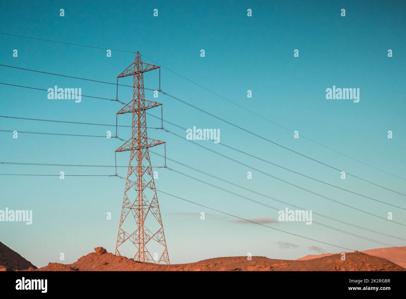 A transmission tower in the deserted, rocky landscape Stock Photo - Alamy