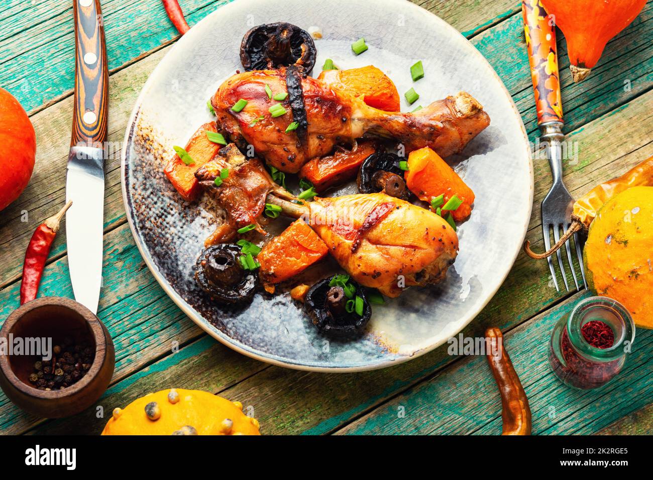 Grilled chicken legs with pumpkin Stock Photo - Alamy