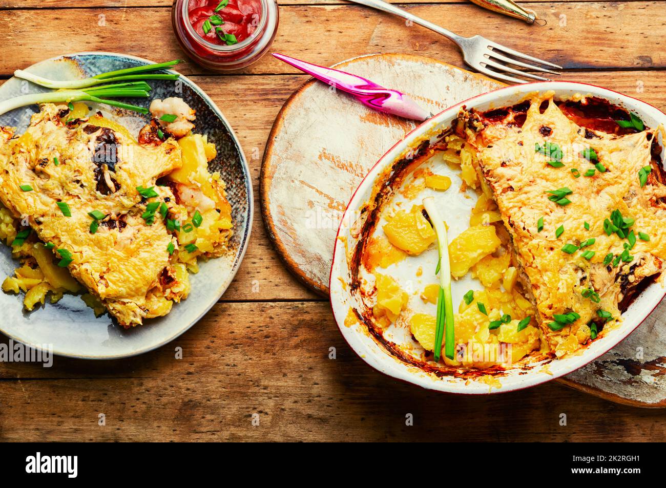 Baked meat with potatoes and cheese Stock Photo - Alamy