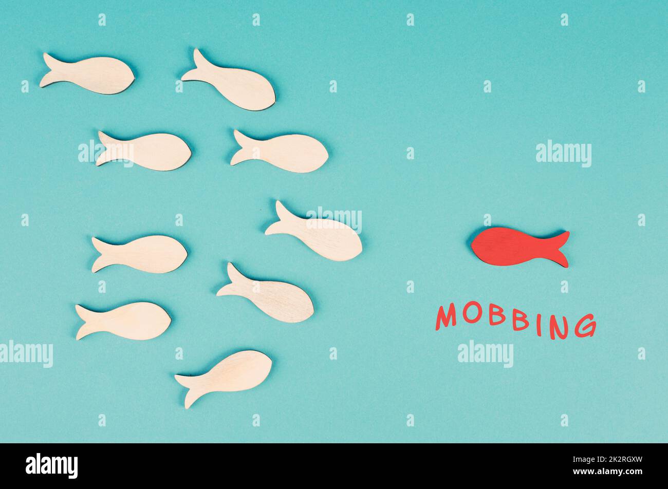 Group of fish mobbing a victim, social conflict, bullying one ...