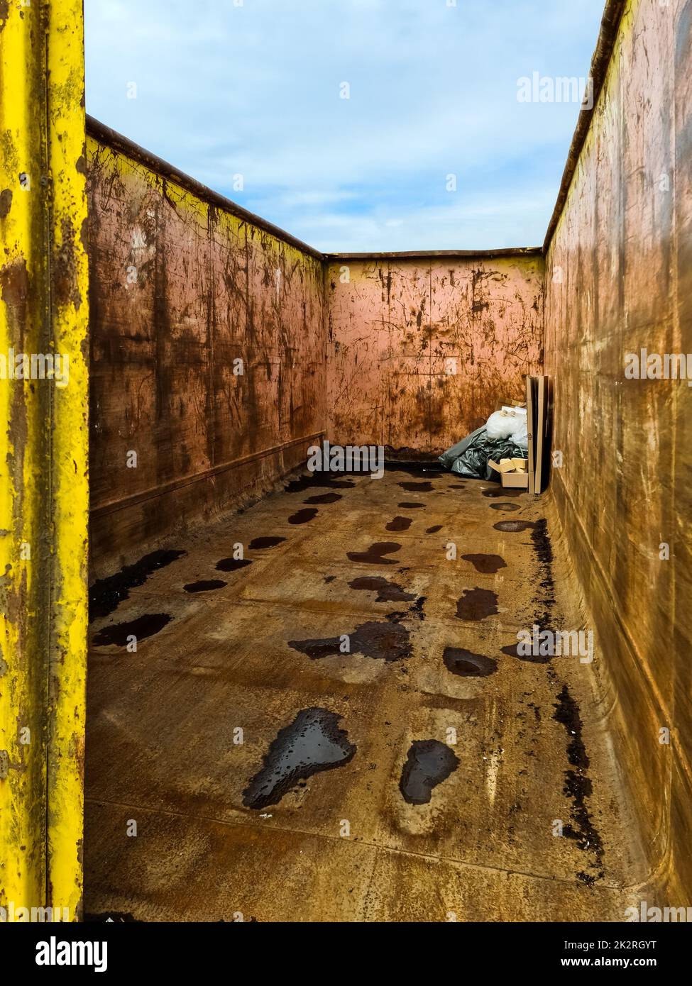 View into an almost empty very rusty industrial garbage container Stock ...