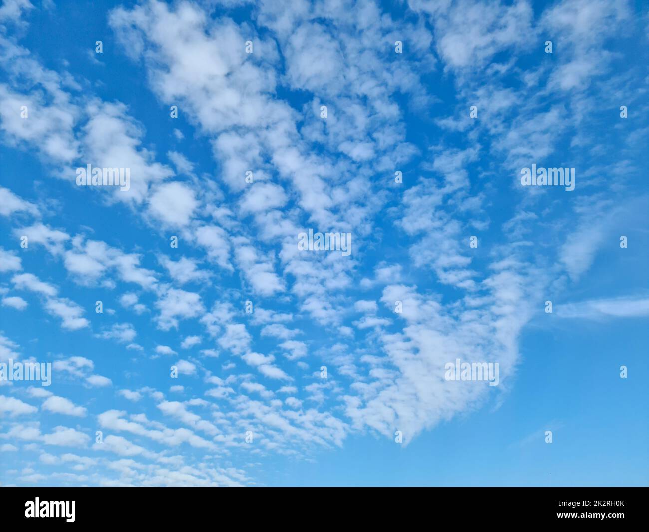 Beautiful fluffy white cloud formations in a deep blue summer sky Stock ...