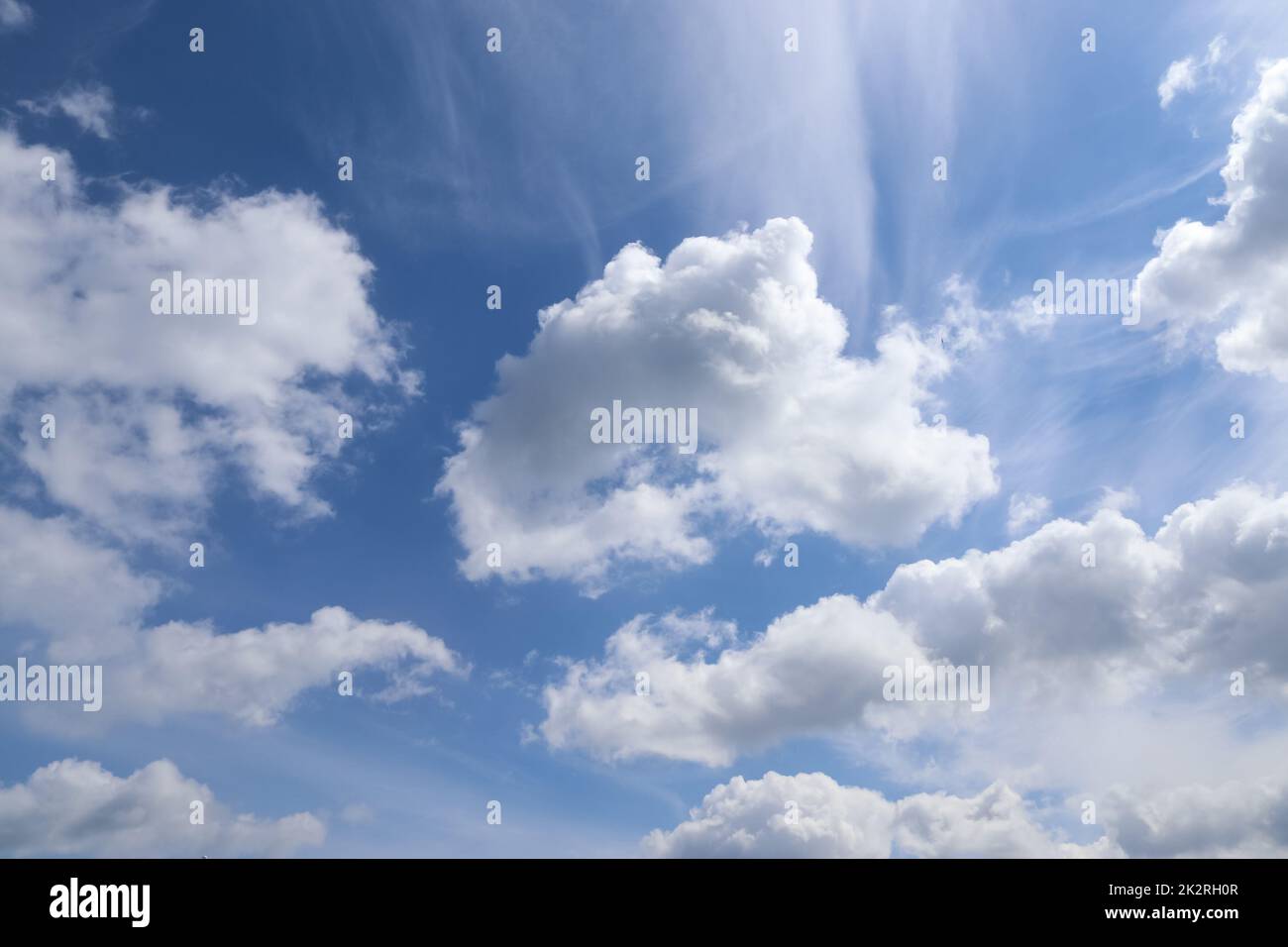 Beautiful fluffy white cloud formations in a deep blue summer sky Stock ...