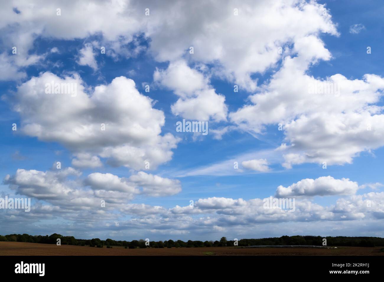 Beautiful fluffy white cloud formations in a deep blue summer sky Stock ...