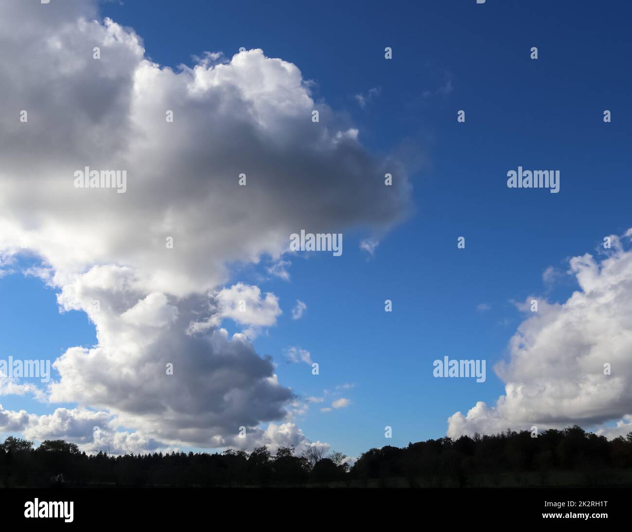 Beautiful fluffy white cloud formations in a deep blue summer sky Stock ...