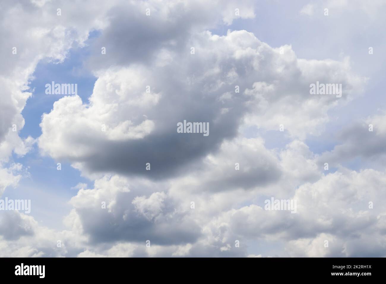 Beautiful fluffy white cloud formations in a deep blue summer sky Stock ...
