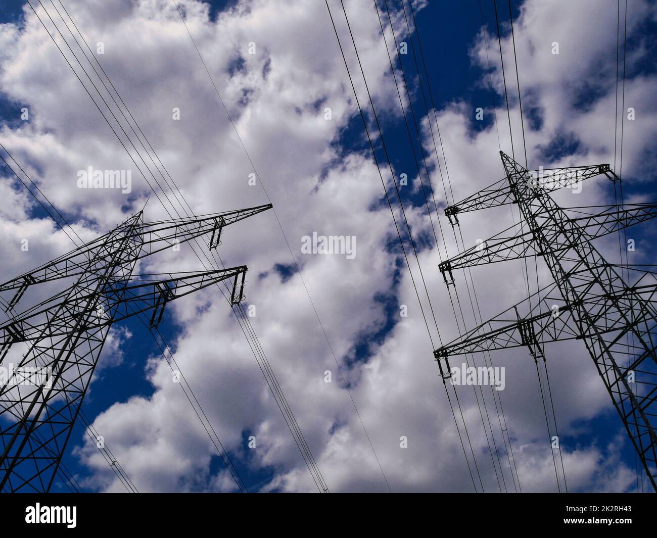 couple of pylon in a green nature landscape Stock Photo - Alamy