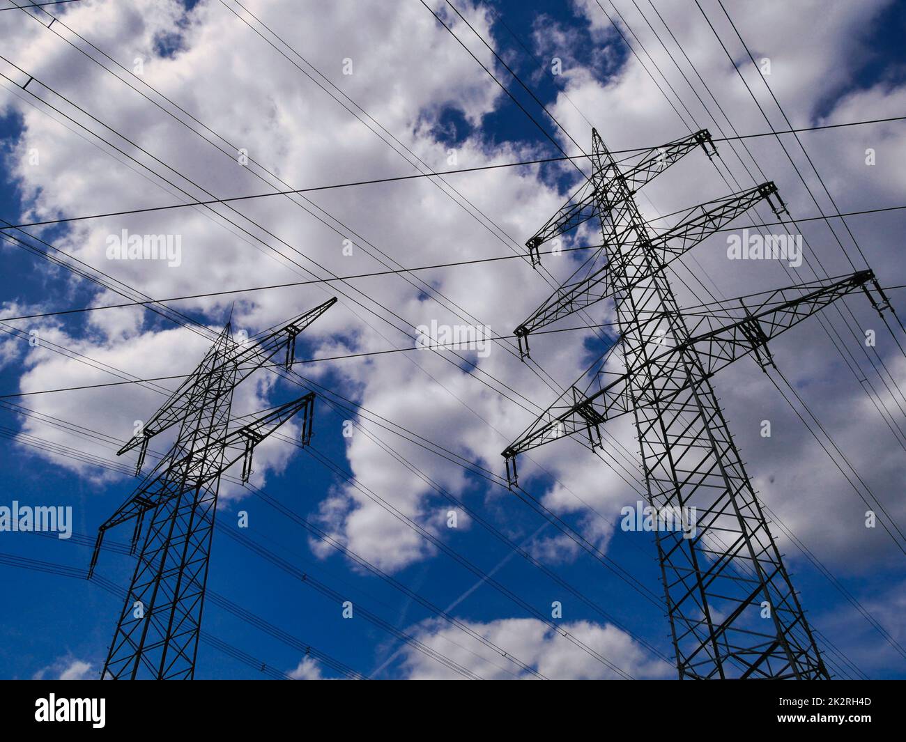 couple of pylon in a green nature landscape Stock Photo - Alamy