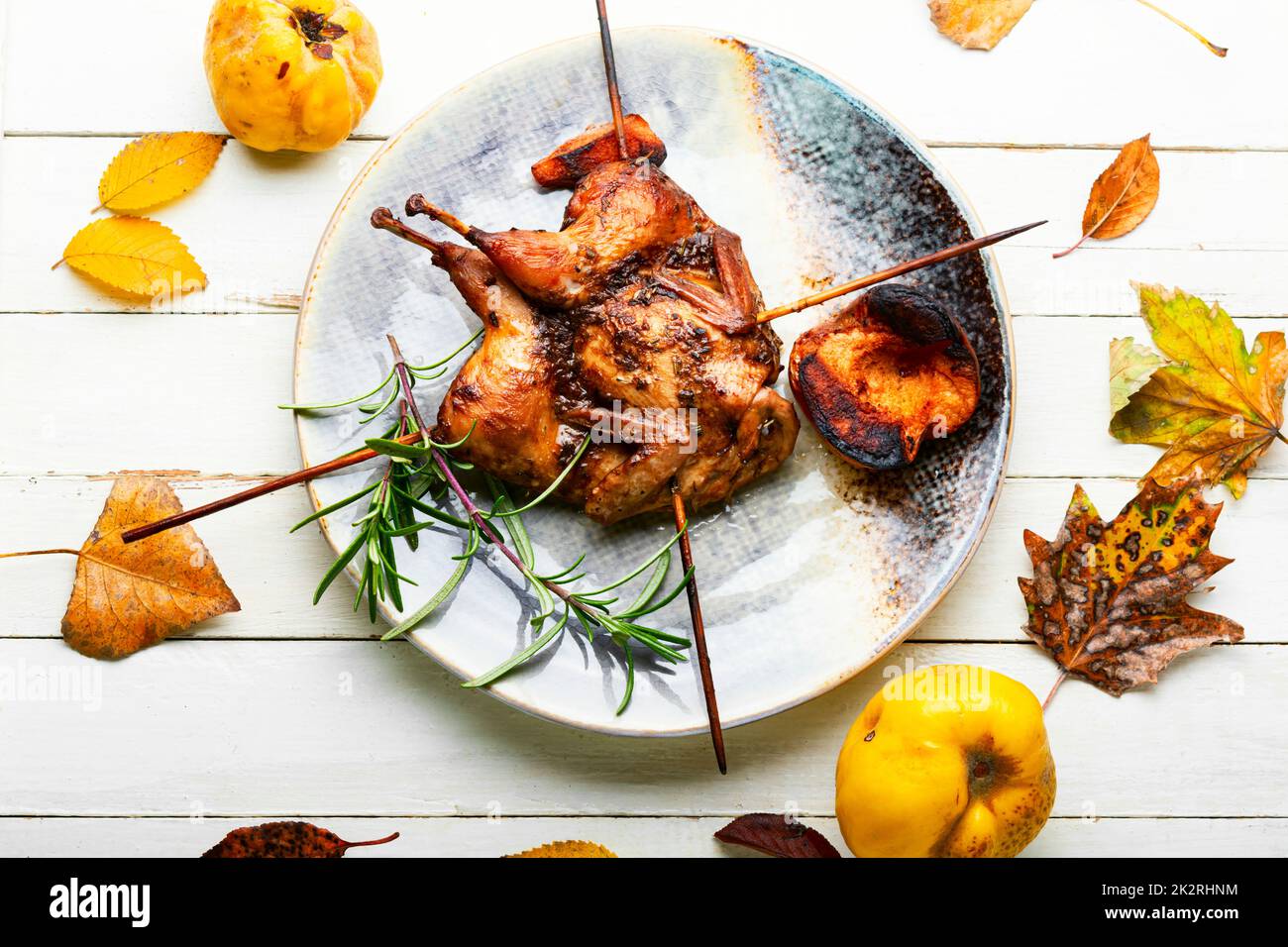 Quail barbecue with quince Stock Photo - Alamy
