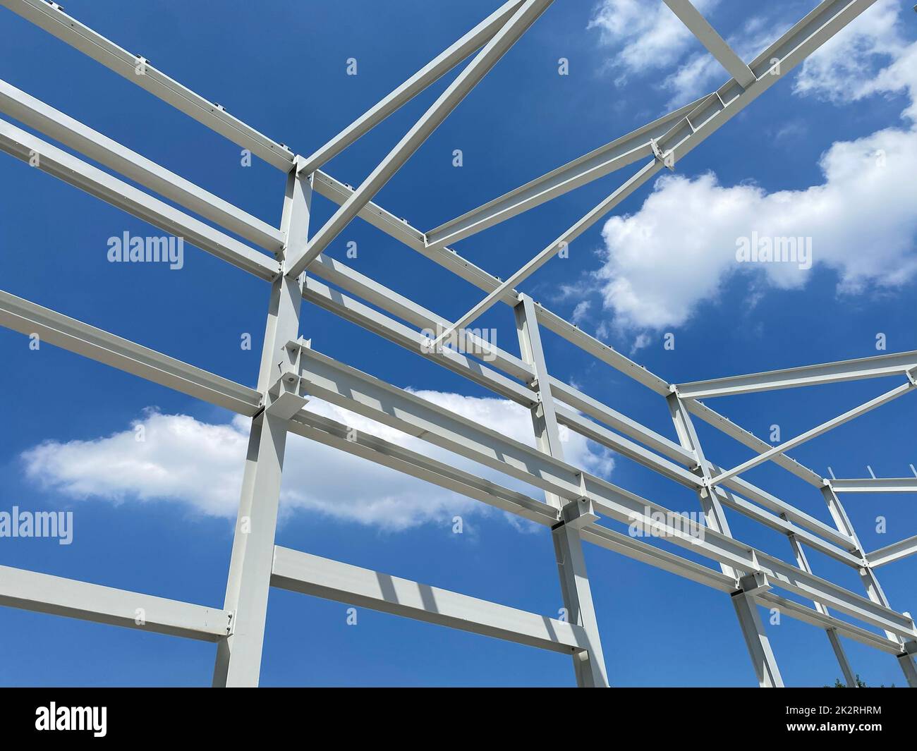 The steel columns and beams on a construction site under a blue sky ...