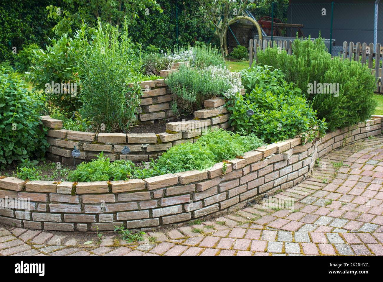 herb spiral in the garden with fresh herbs Stock Photo - Alamy