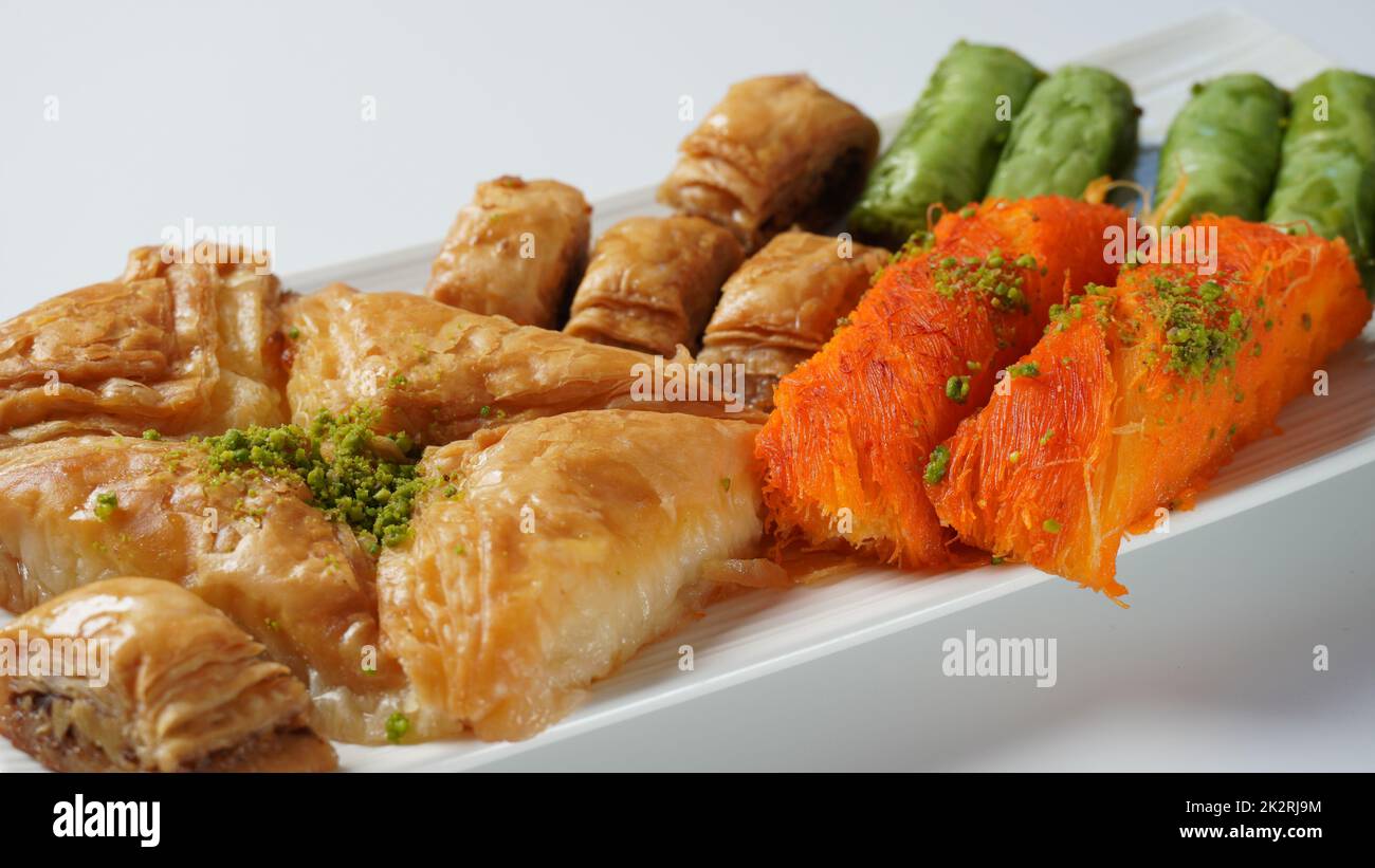 A tray of Turkish pastries including baklava, knafeh - a Middle Eastern ...