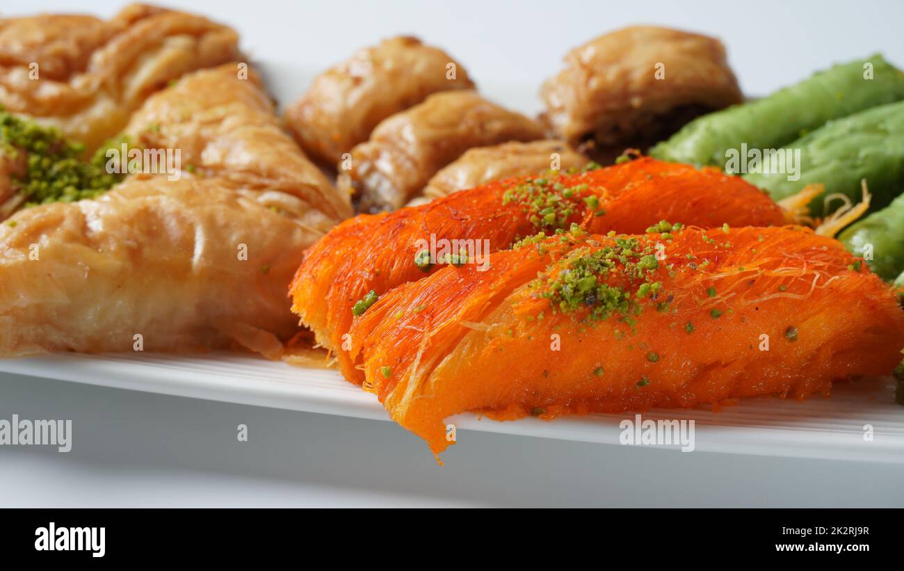 A tray of Turkish pastries including baklava, knafeh - a Middle Eastern ...