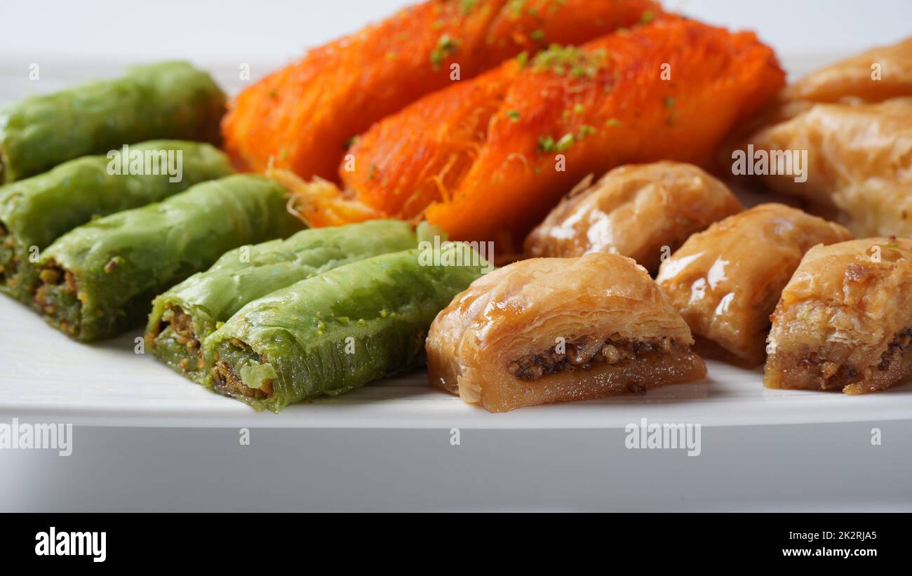 A tray of Turkish pastries including baklava, knafeh - a Middle Eastern ...