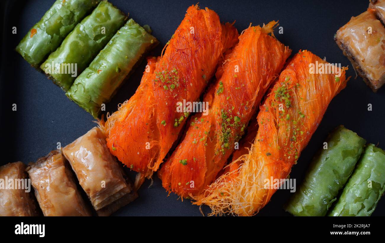 A tray of Turkish pastries including baklava, knafeh - a Middle Eastern ...