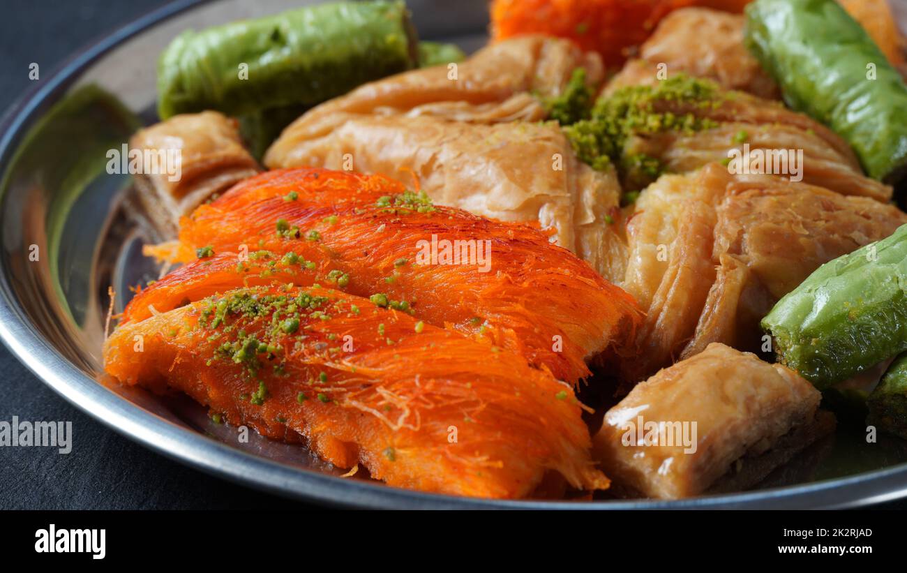 A tray of Turkish pastries including baklava, knafeh - a Middle Eastern ...