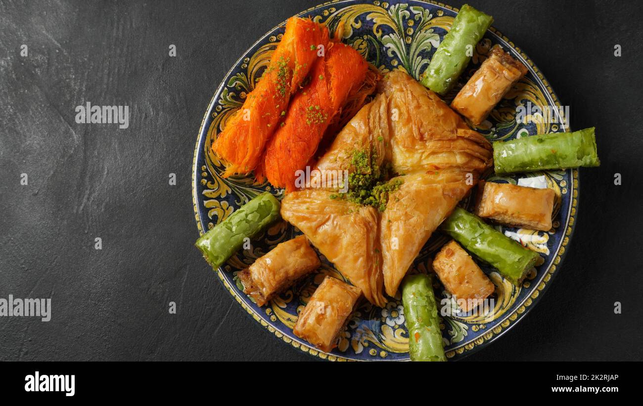 A tray of Turkish pastries including baklava, knafeh - a Middle Eastern ...