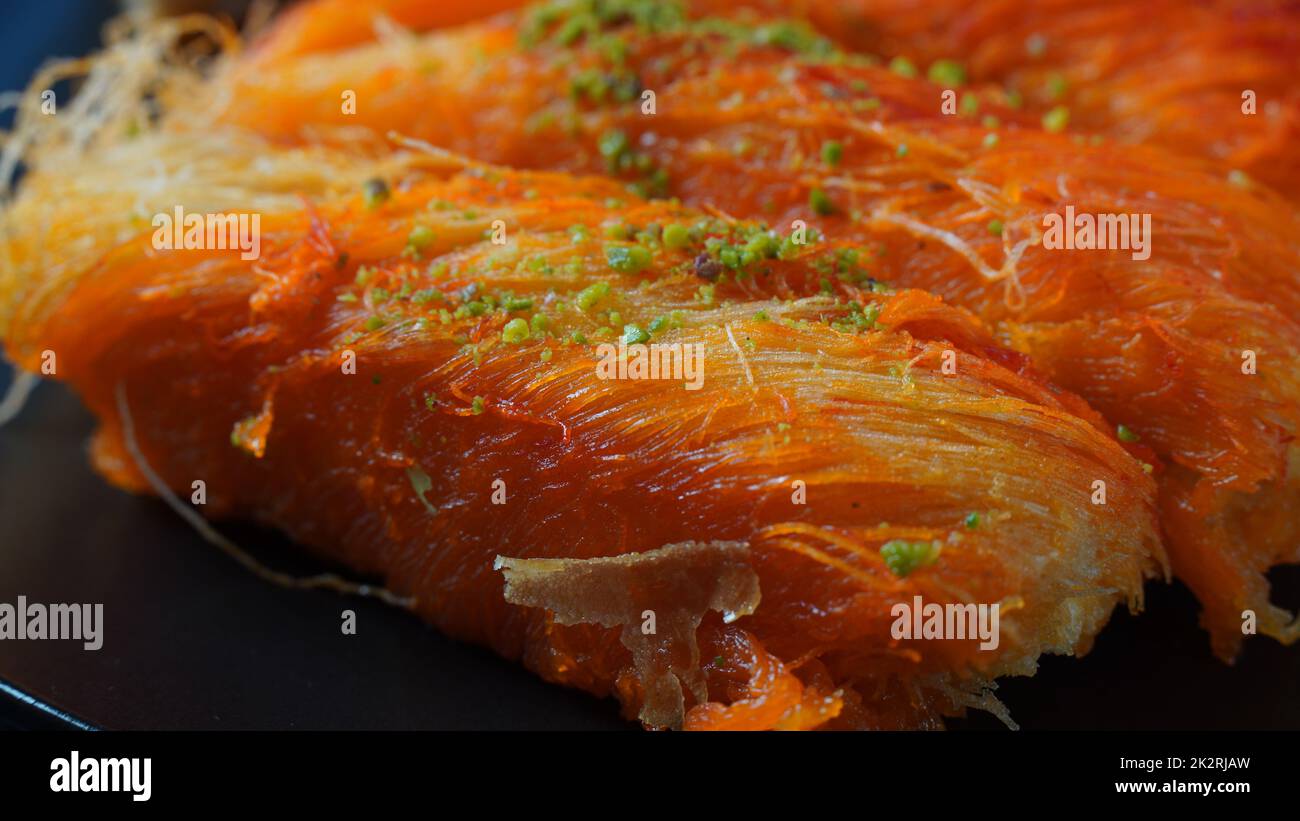 Knafeh - a Middle Eastern cheese pastry soaked in sweet, sugar-based ...