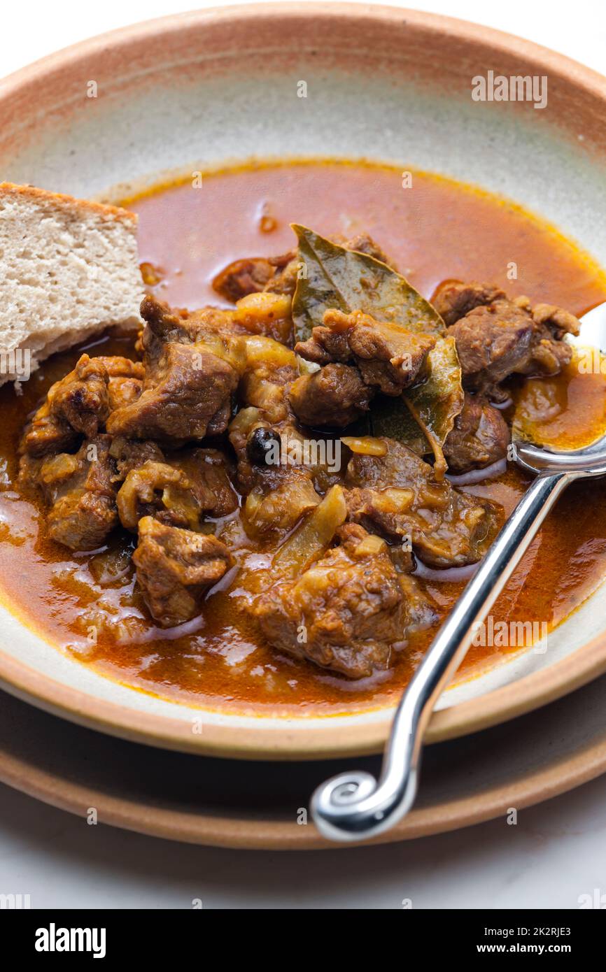Czech beef goulash served with bread Stock Photo - Alamy