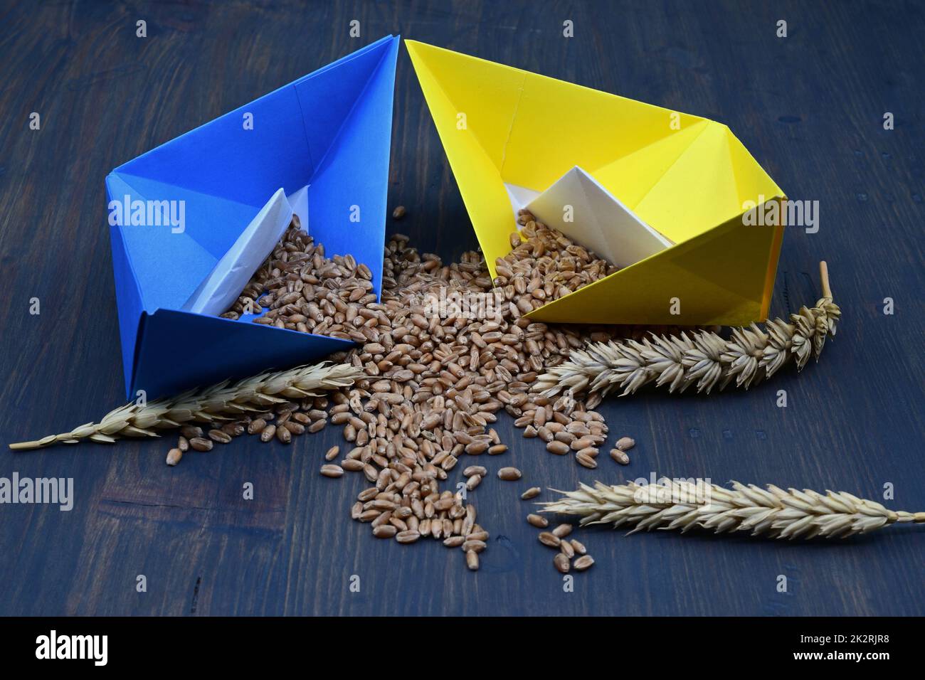 Ukrainian flag colors origami boats and wheat Stock Photo - Alamy