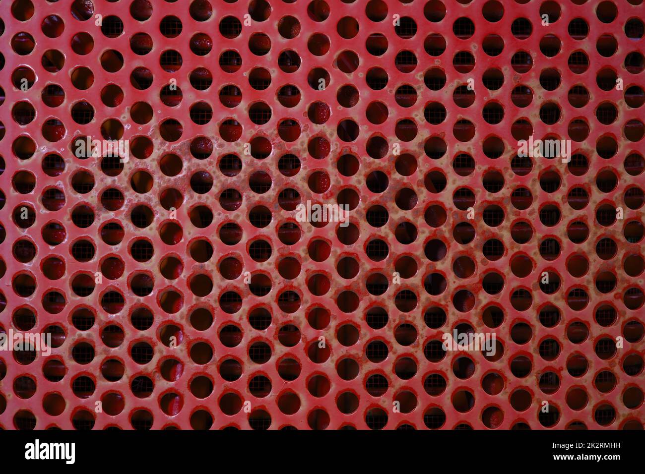 red metal grid circle holes painted iron industrial texture background ...