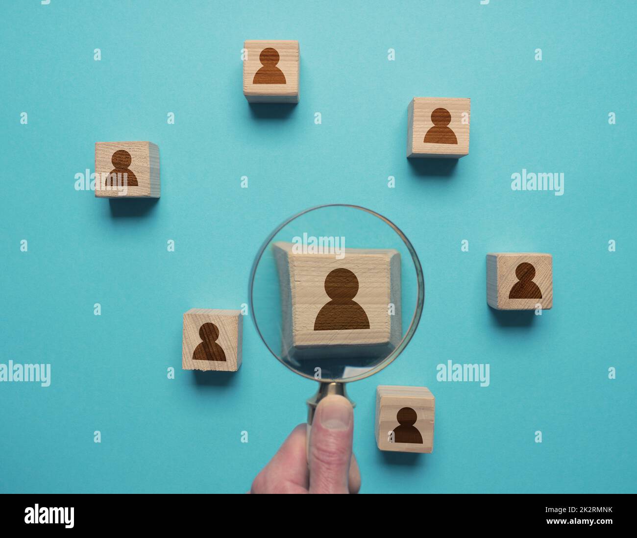 Man with magnifying glass searches for the ideal employee Stock Photo ...