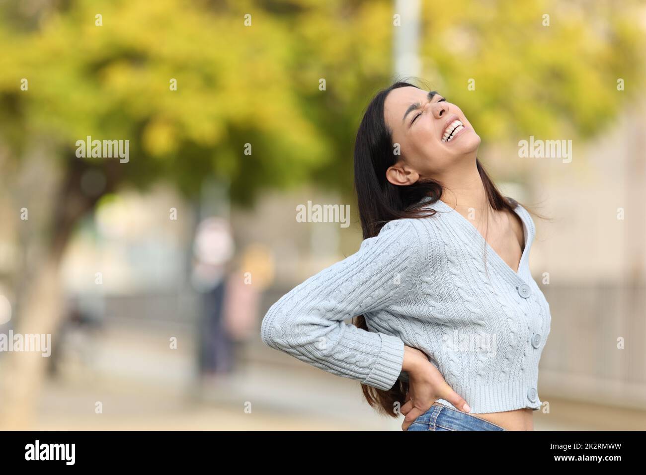 Stressed woman complaining suffering lumbago attack Stock Photo - Alamy