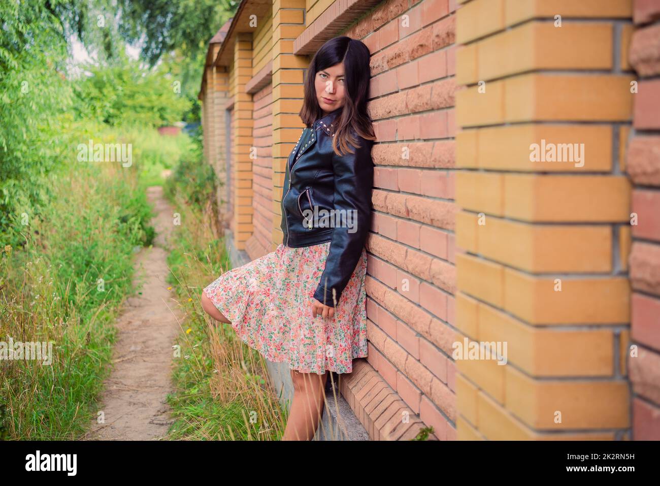 Girl leaning wall hi-res stock photography and images - Alamy