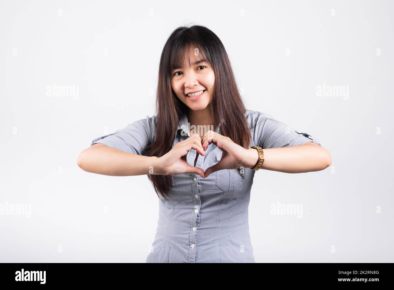 Woman smiling confidence make finger heart gesture figure symbol shape ...