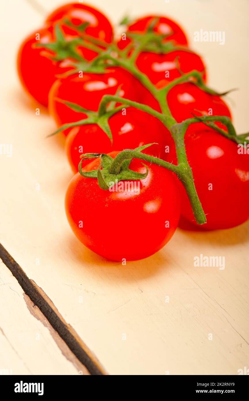 fresh cherry tomatoes on a cluster Stock Photo - Alamy