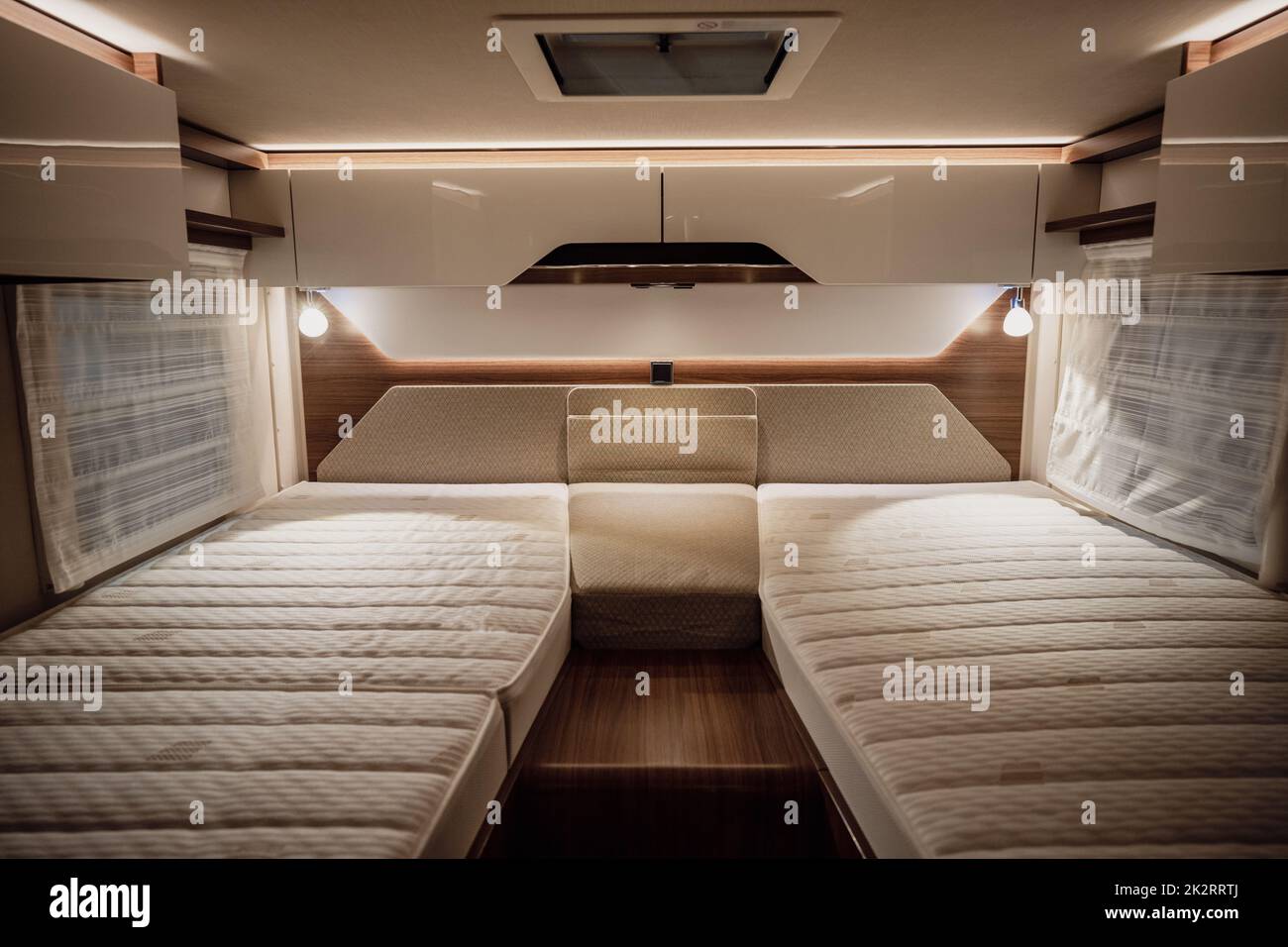 Bed inside a new luxury camper van motorhome Stock Photo - Alamy