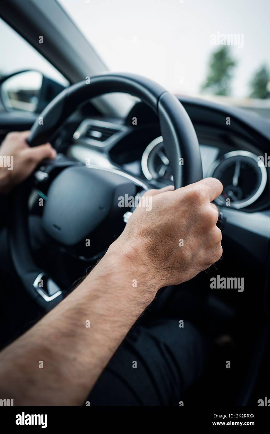 Human hands on wheel hi-res stock photography and images - Alamy