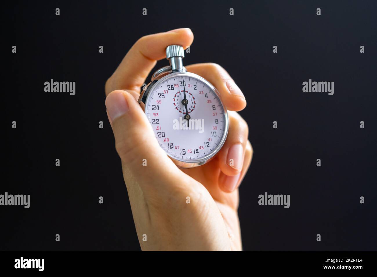Hand holding stopwatch hi-res stock photography and images - Alamy