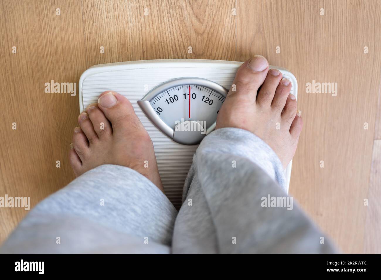 Person Standing On Weighing Scale Stock Photo - Alamy